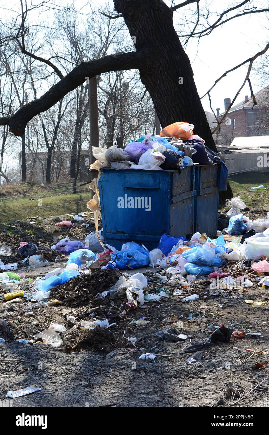 The garbage can is packed with garbage and waste. Untimely removal of ...