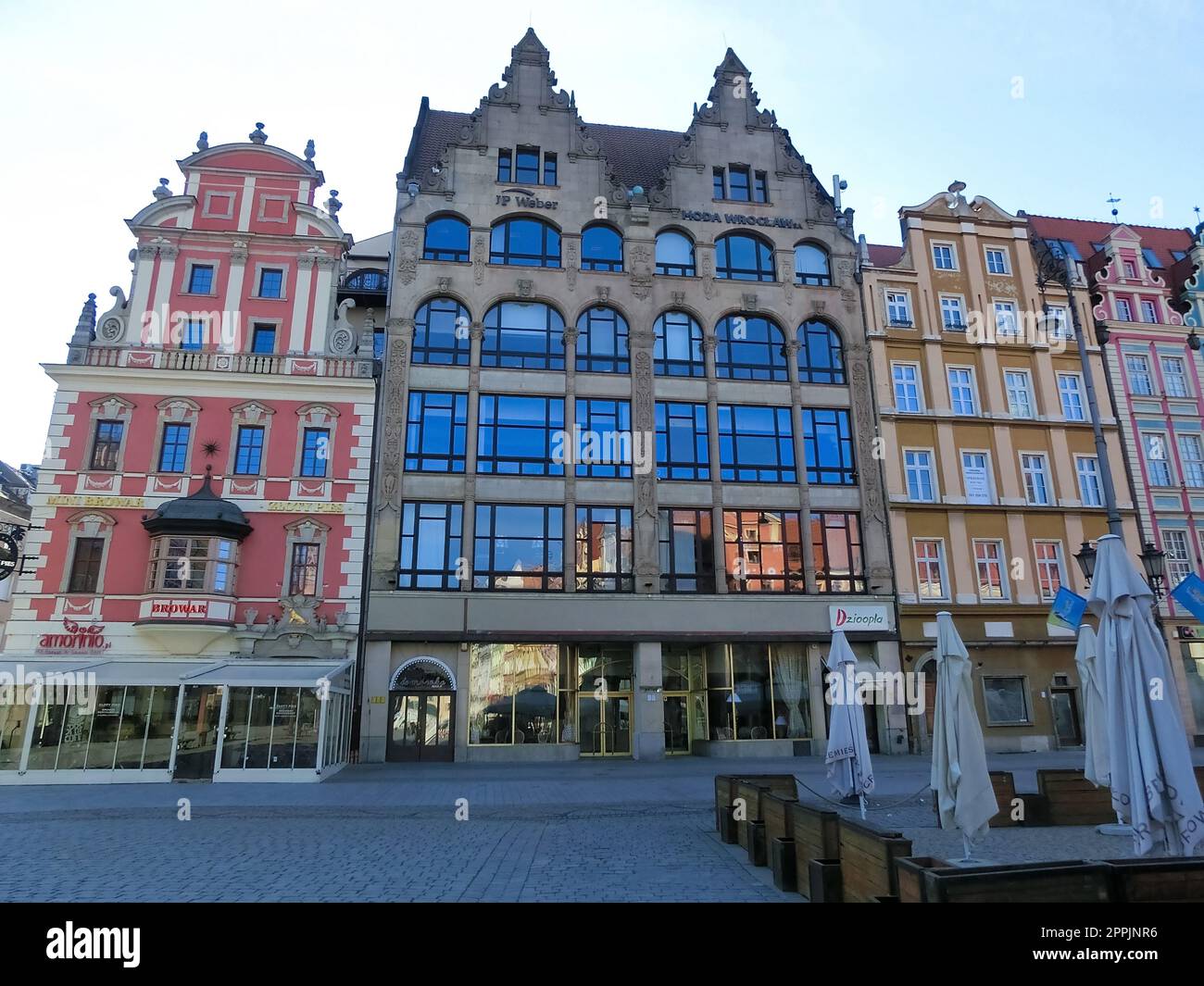 old town hall building with a clock in the center on Wroclaw Square ...