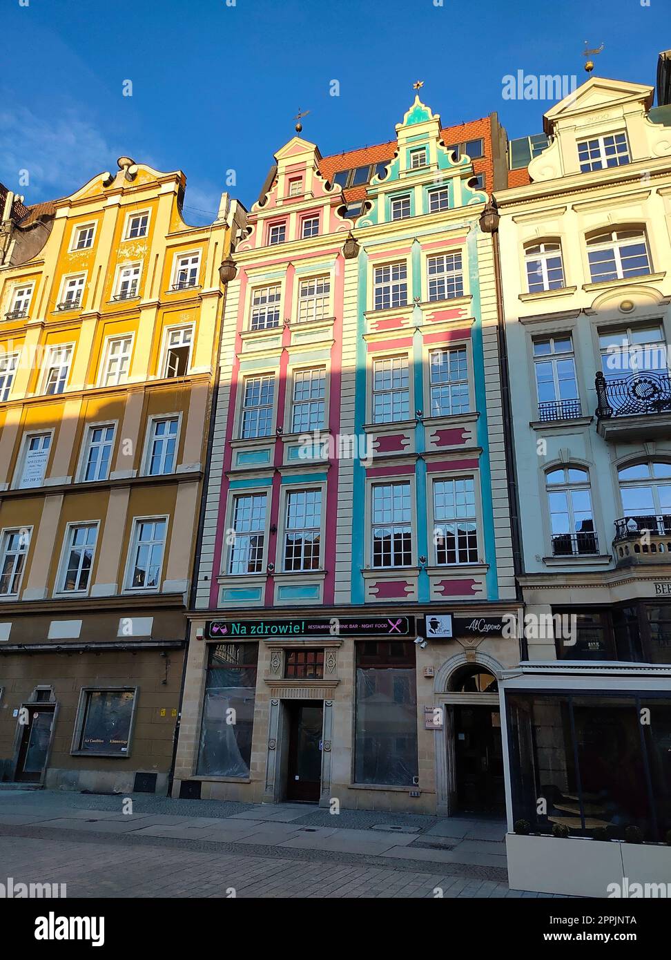 old town hall building with a clock in the center on Wroclaw Square ...