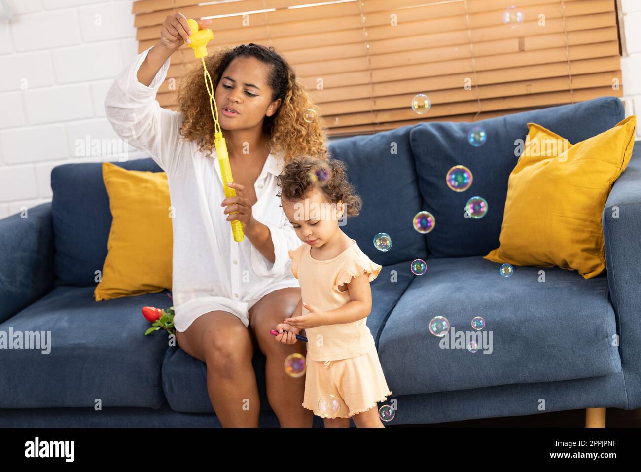 Parents teach children how to walk, hold objects, take turns, play ...