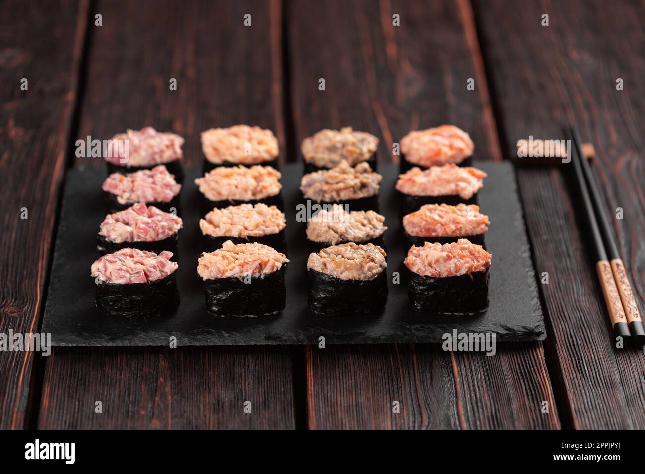 Set of Gunkan Maki Sushi with different types of fish salmon, scallop ...