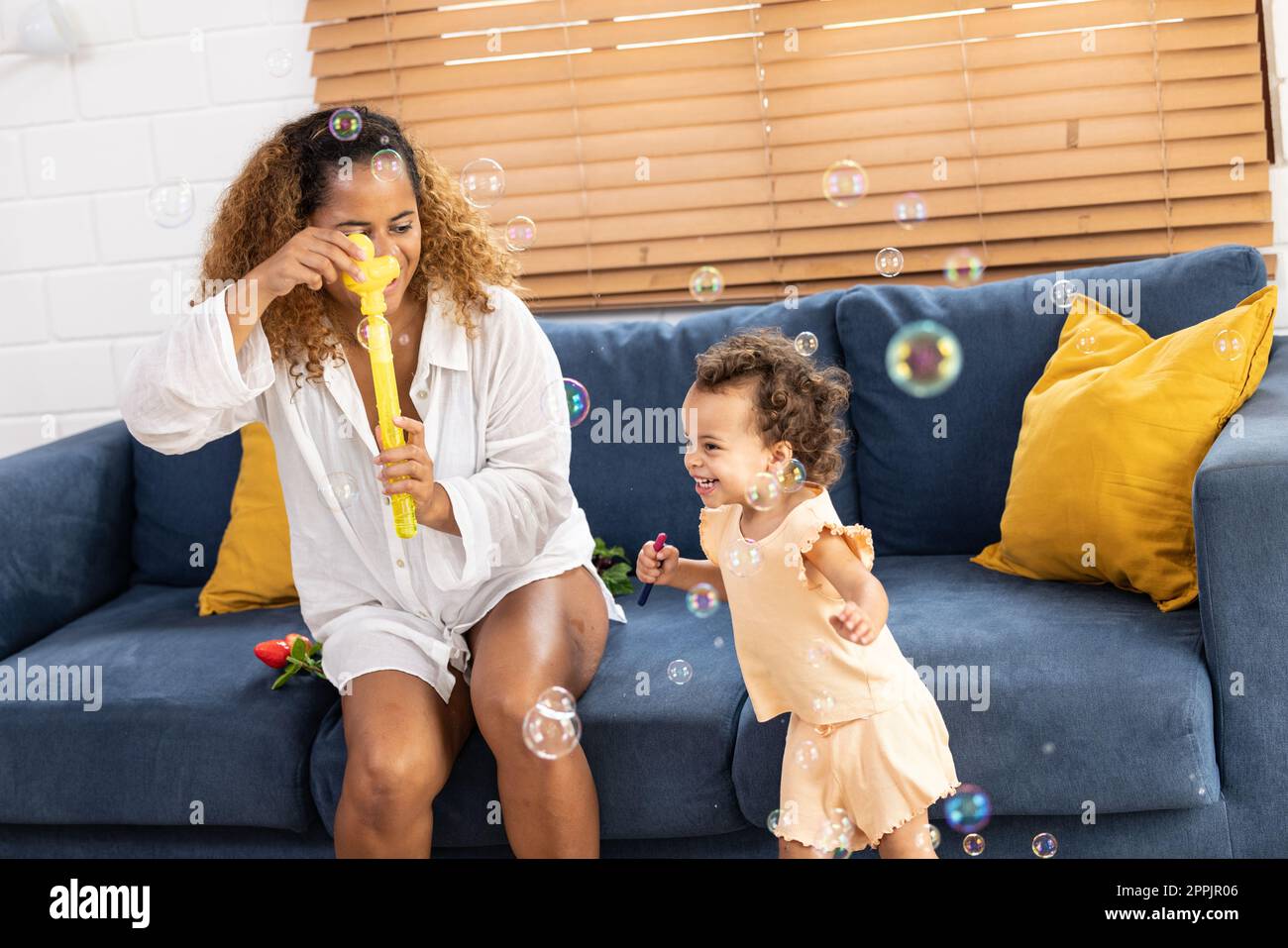 Parents teach children how to walk, hold objects, take turns, play ...