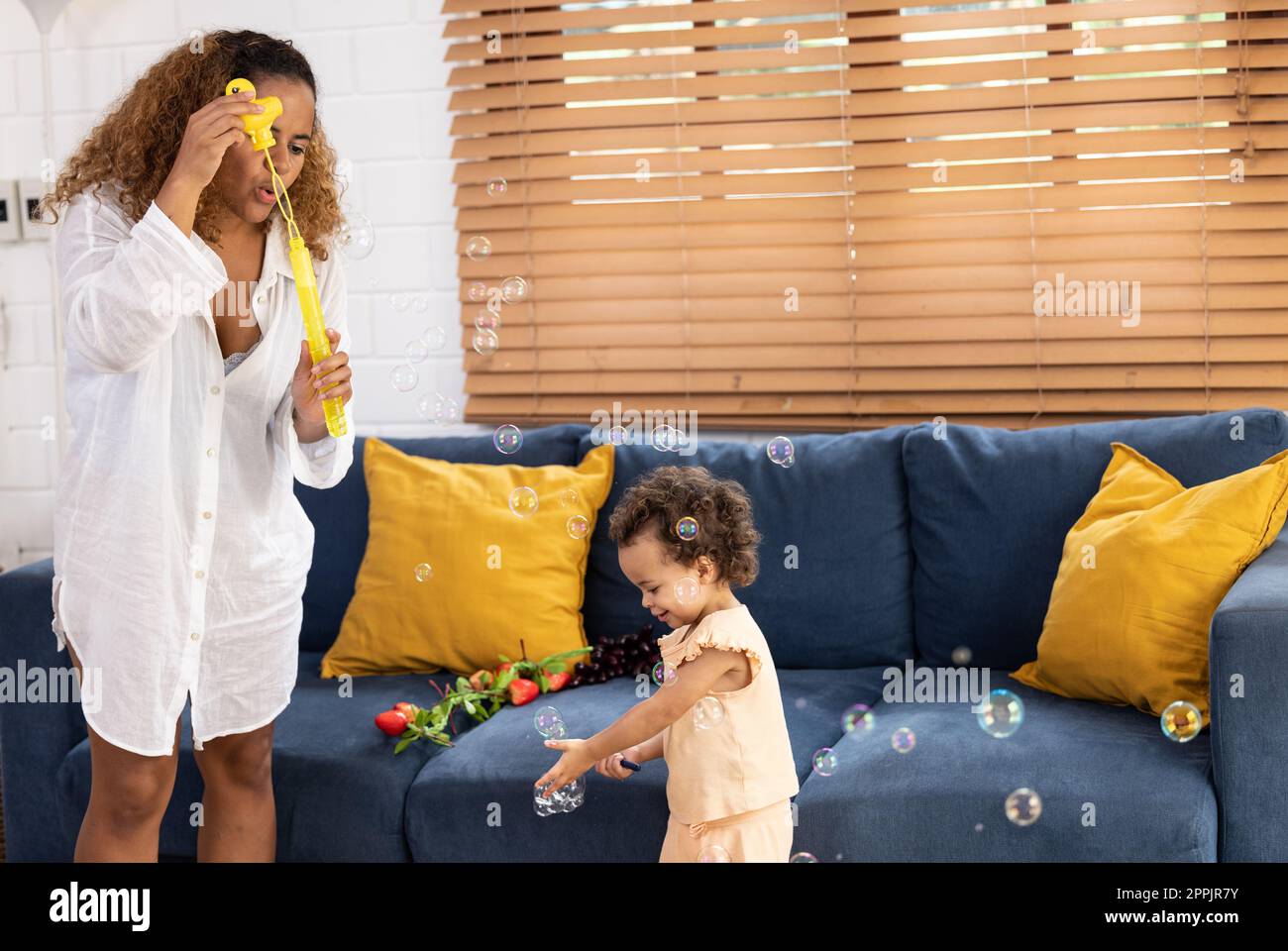 Parents teach children how to walk, hold objects, take turns, play ...