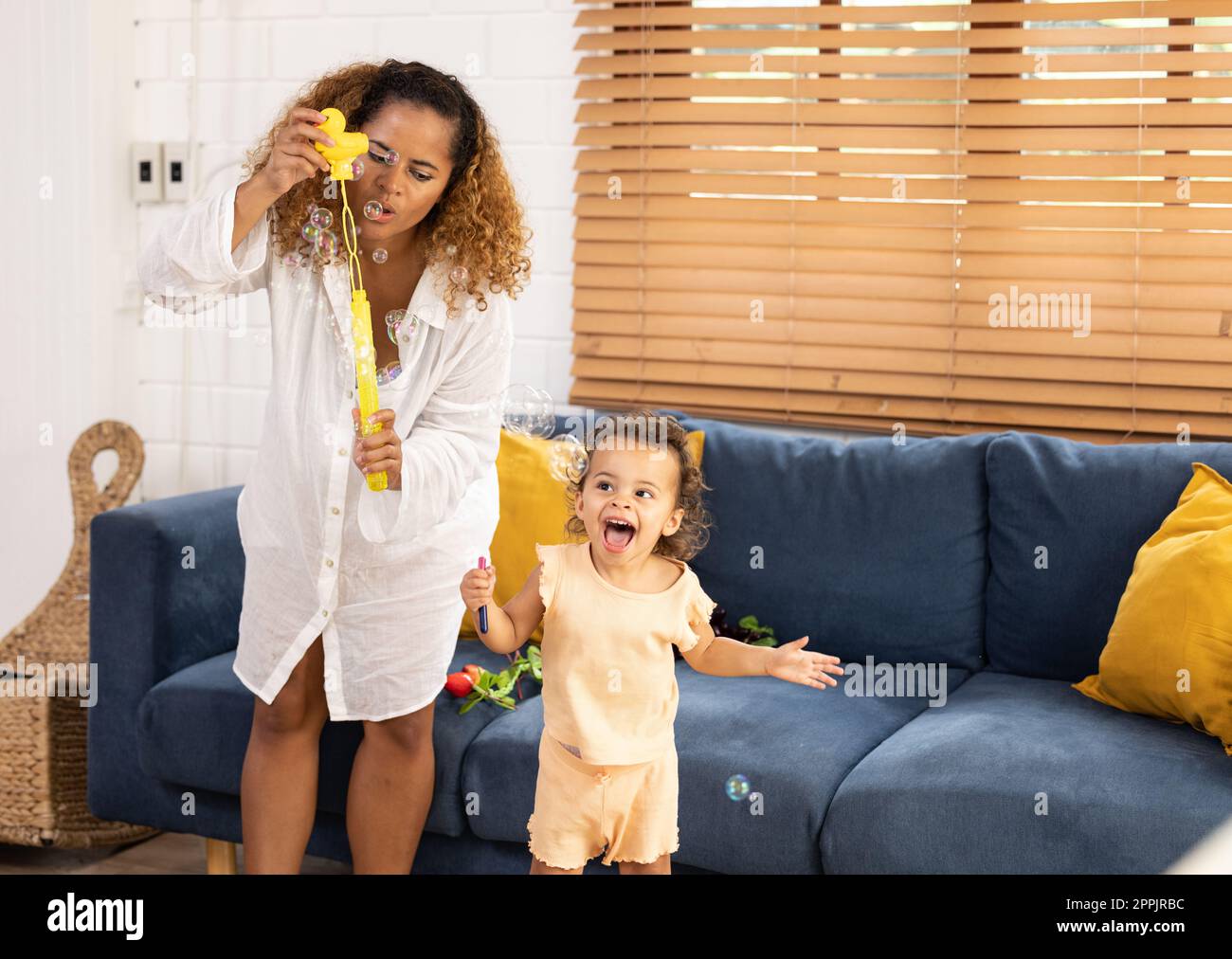 Parents teach children how to walk, hold objects, take turns, play ...