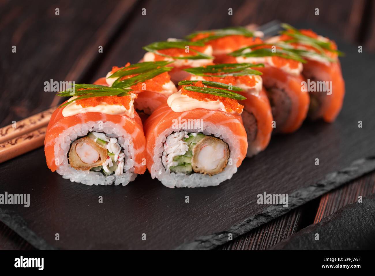 Sushi roll philadelphia with crab and cucumber and cream cheese, caviar ...