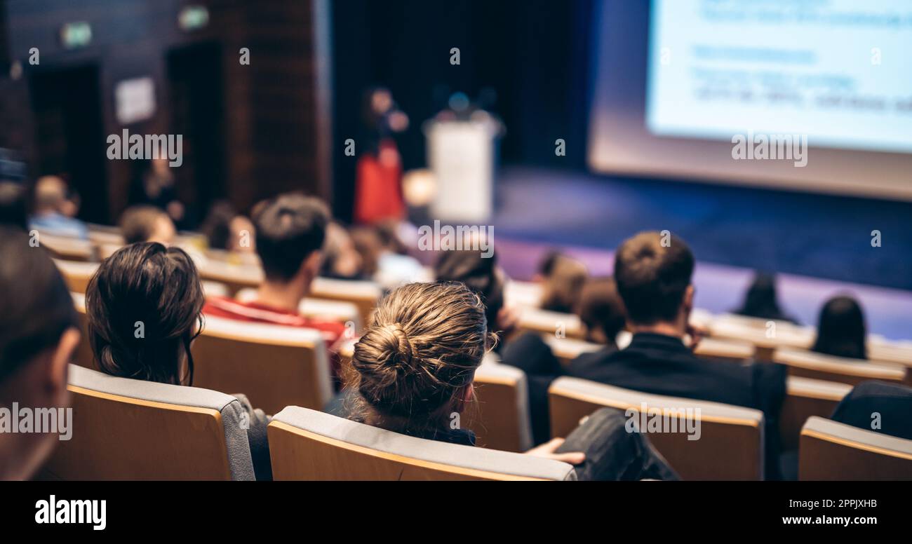 Woman giving presentation on business conference event Stock Photo - Alamy