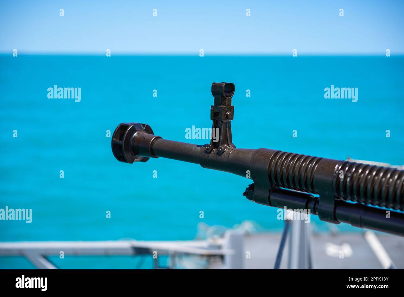 Automated machine gun on the deck of a military ship Stock Photo - Alamy
