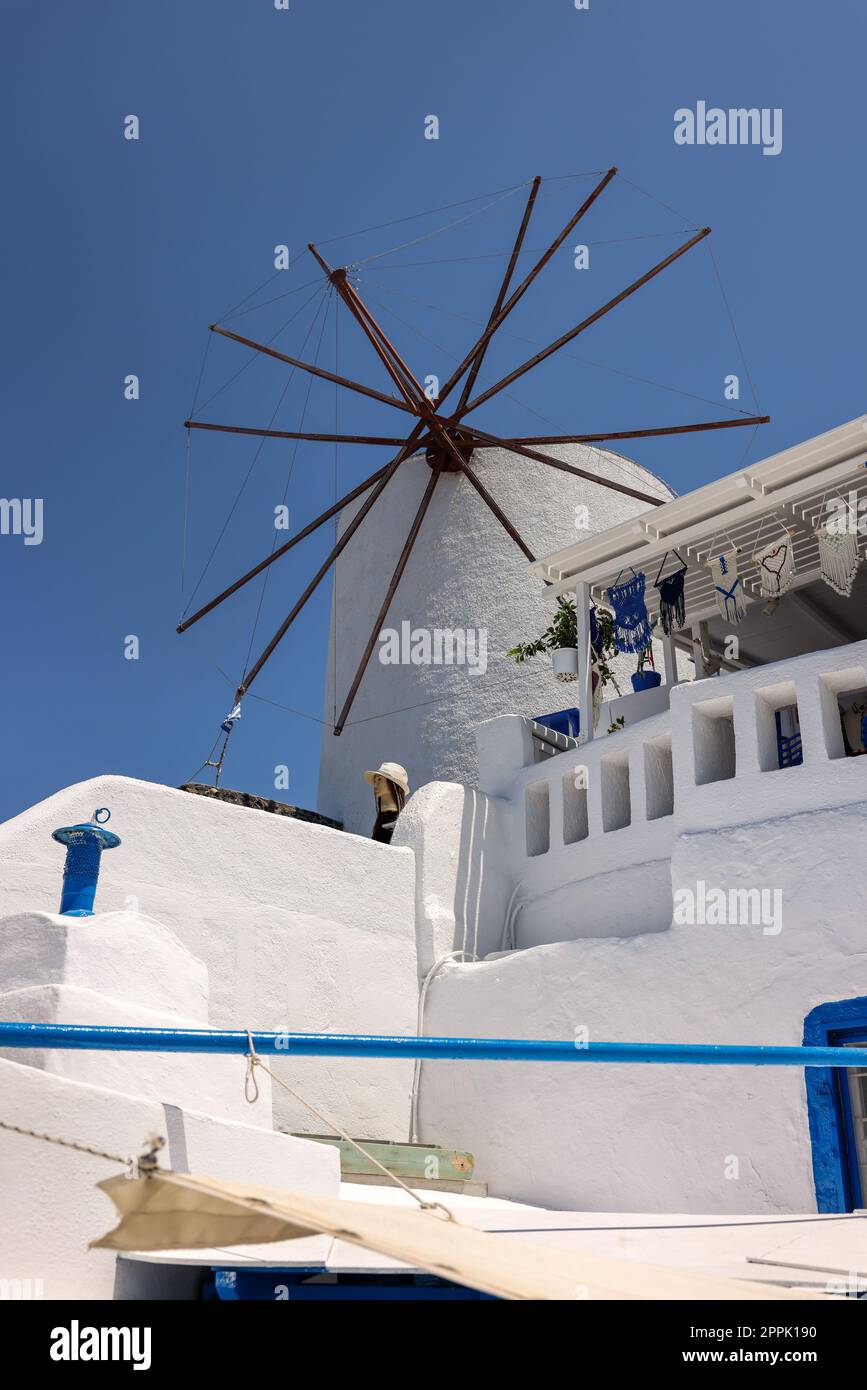 Traditional white windmill in Oia on Santorini Stock Photo - Alamy