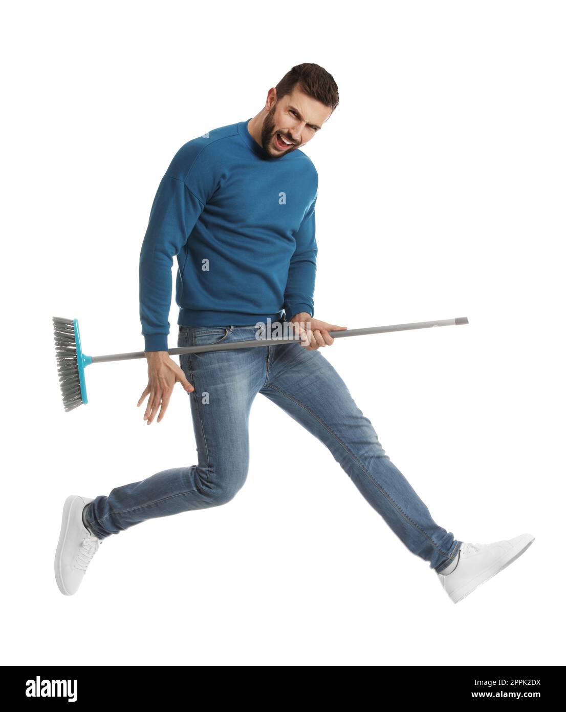 Man with broom jumping on white background Stock Photo - Alamy