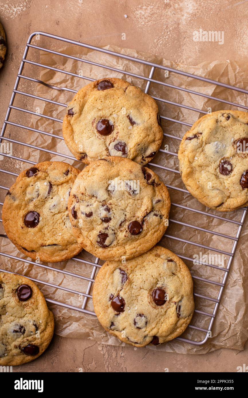 Chocolate chip cookies with flaky salt on a cooling rack, homemade ...