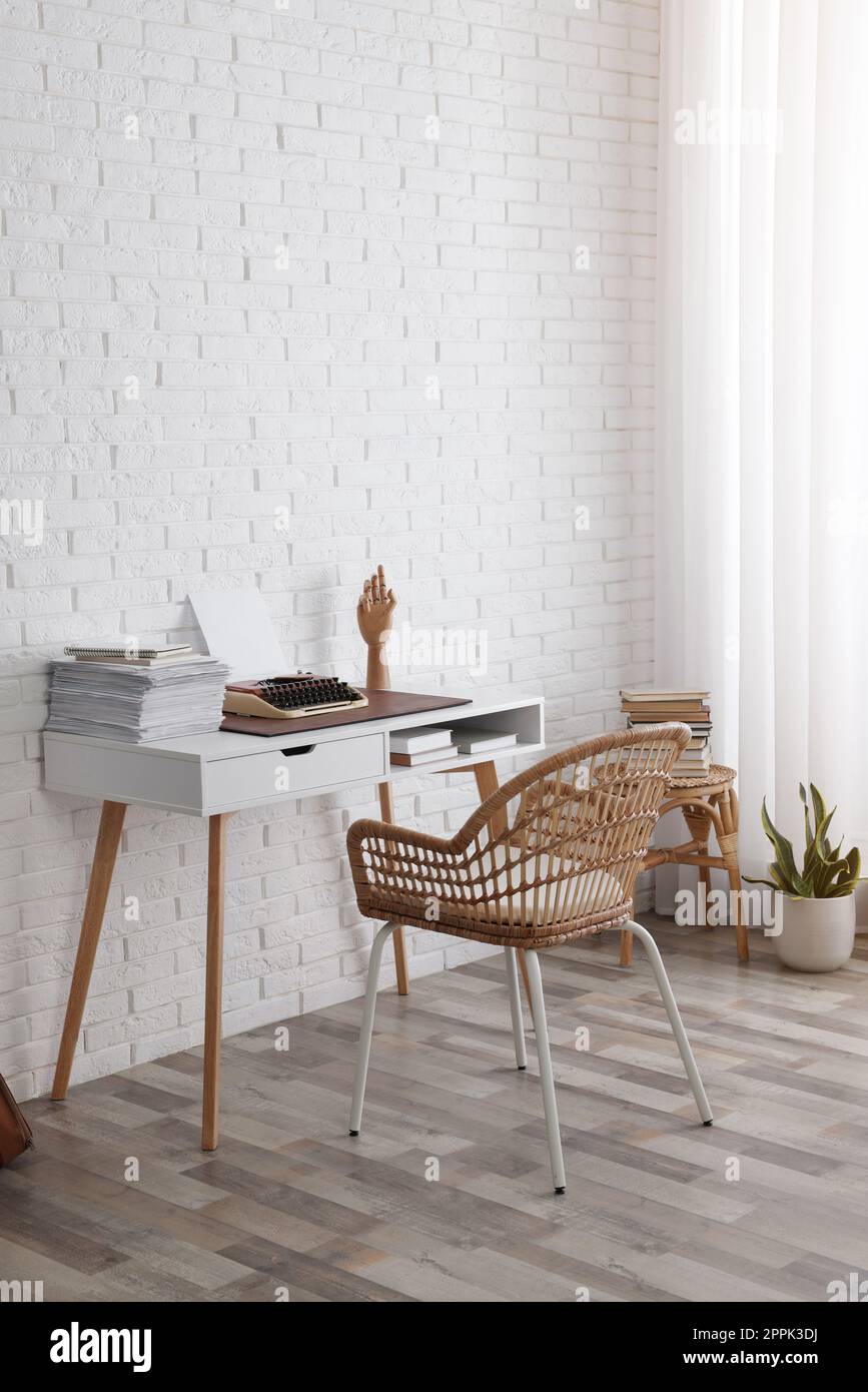 Comfortable writer's workplace interior with typewriter on desk near ...