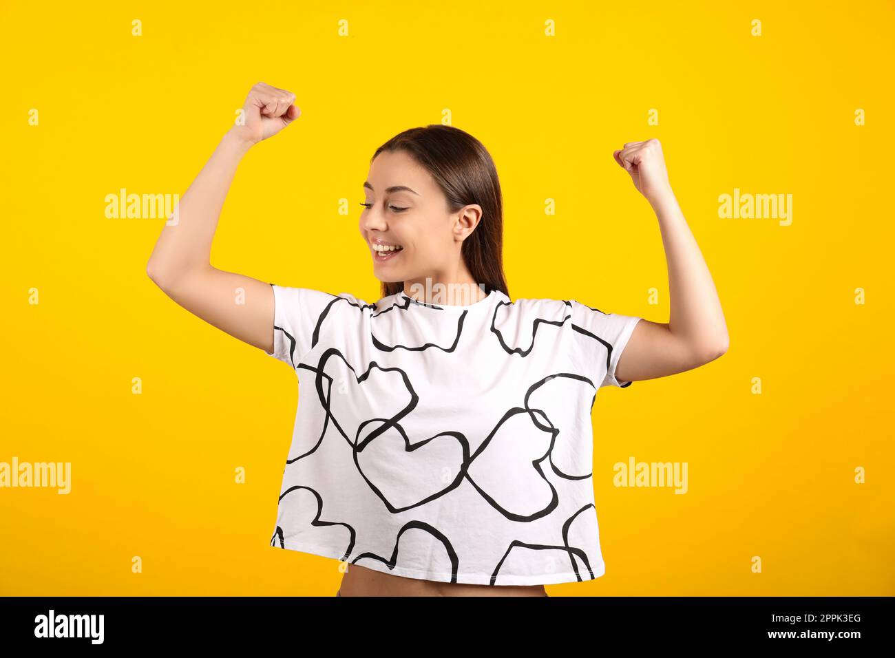 Strong woman as symbol of girl power on yellow background. 8 March ...