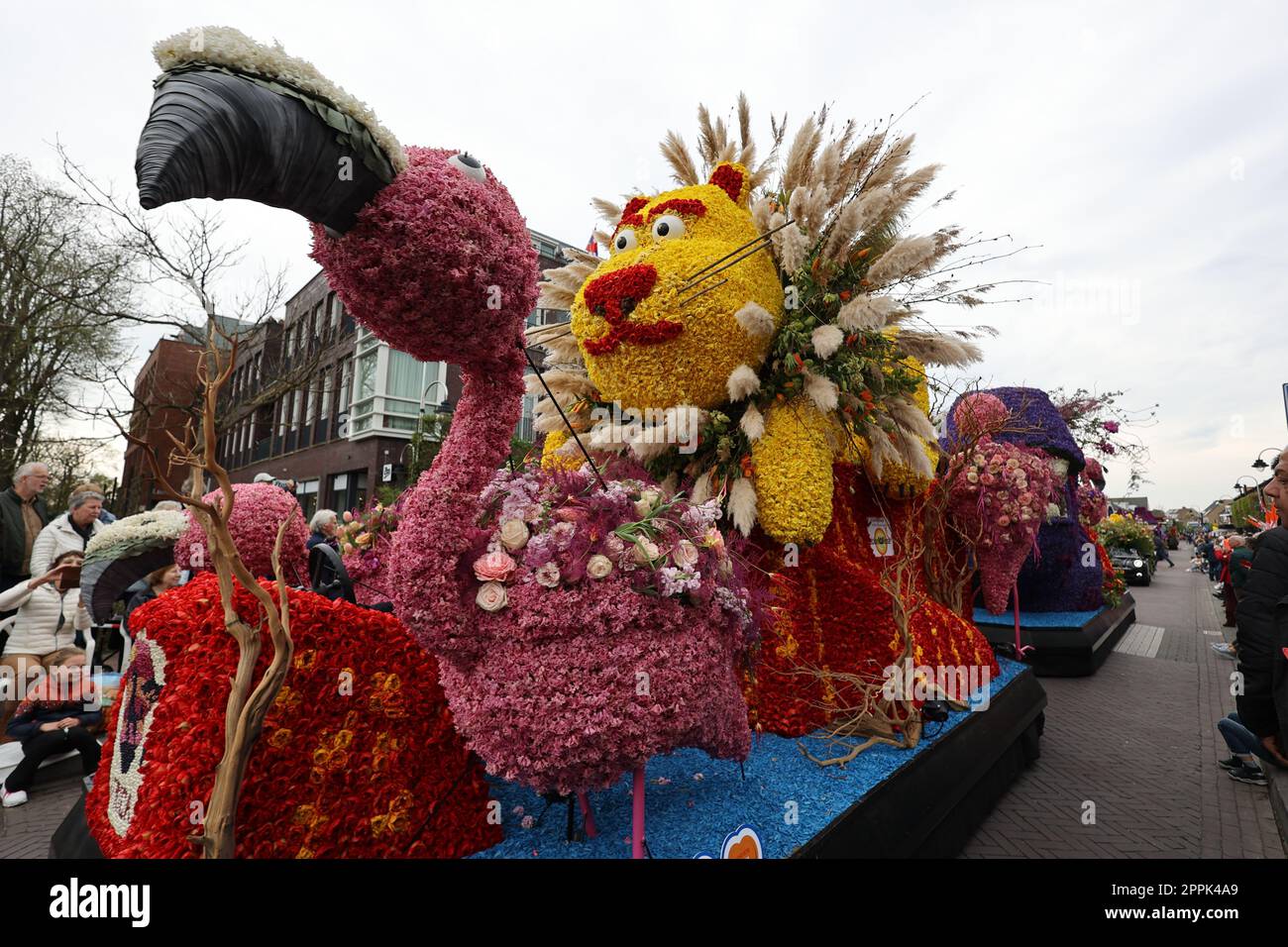 A festive float decorated with a vibrant floral arrangement at the ...