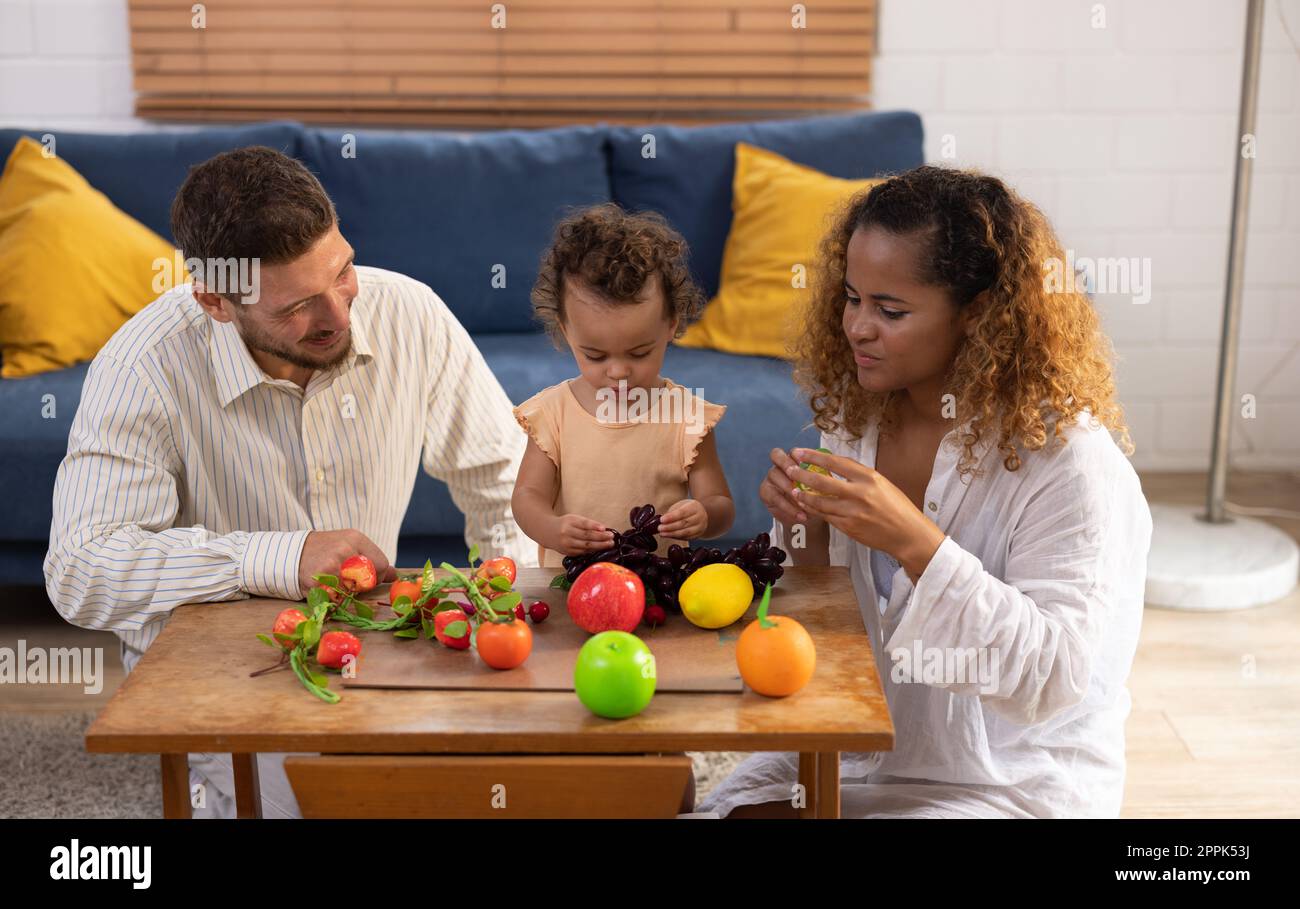 Parents teach children how to walk, hold objects, take turns, play ...