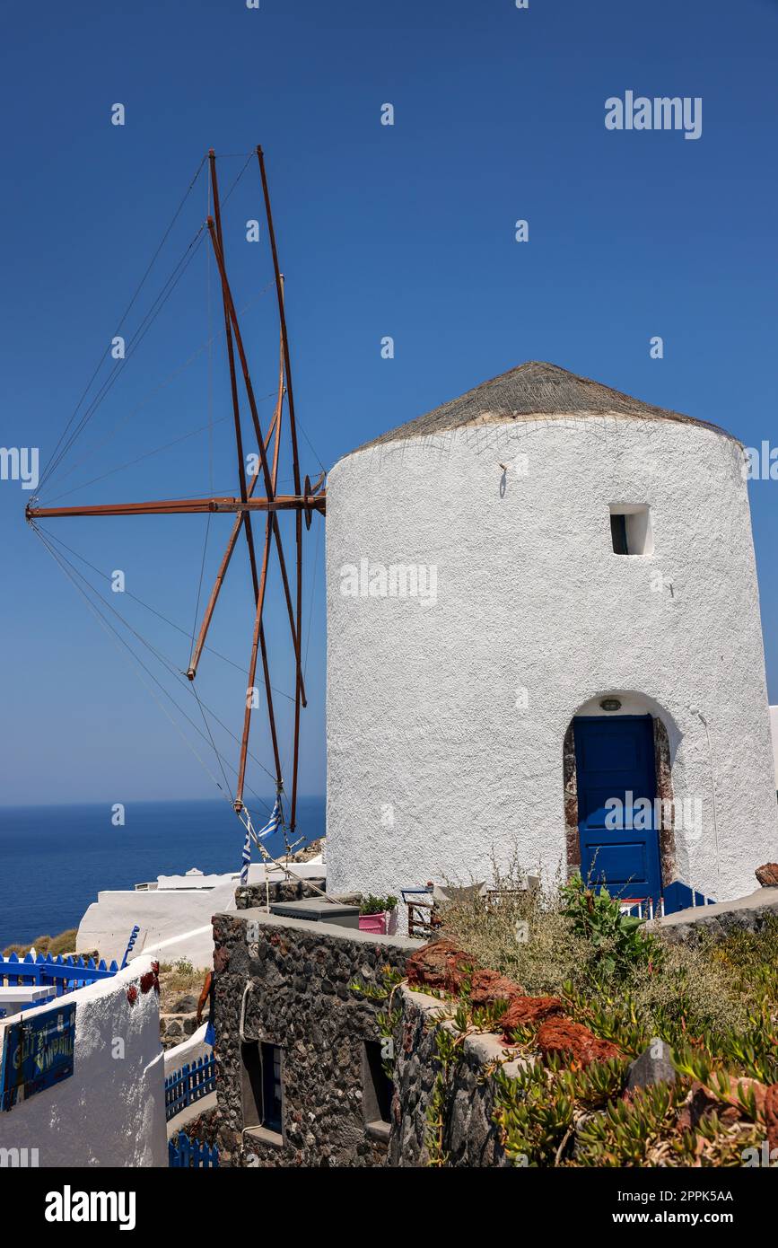 Traditional white windmill in Oia on Santorini Stock Photo - Alamy
