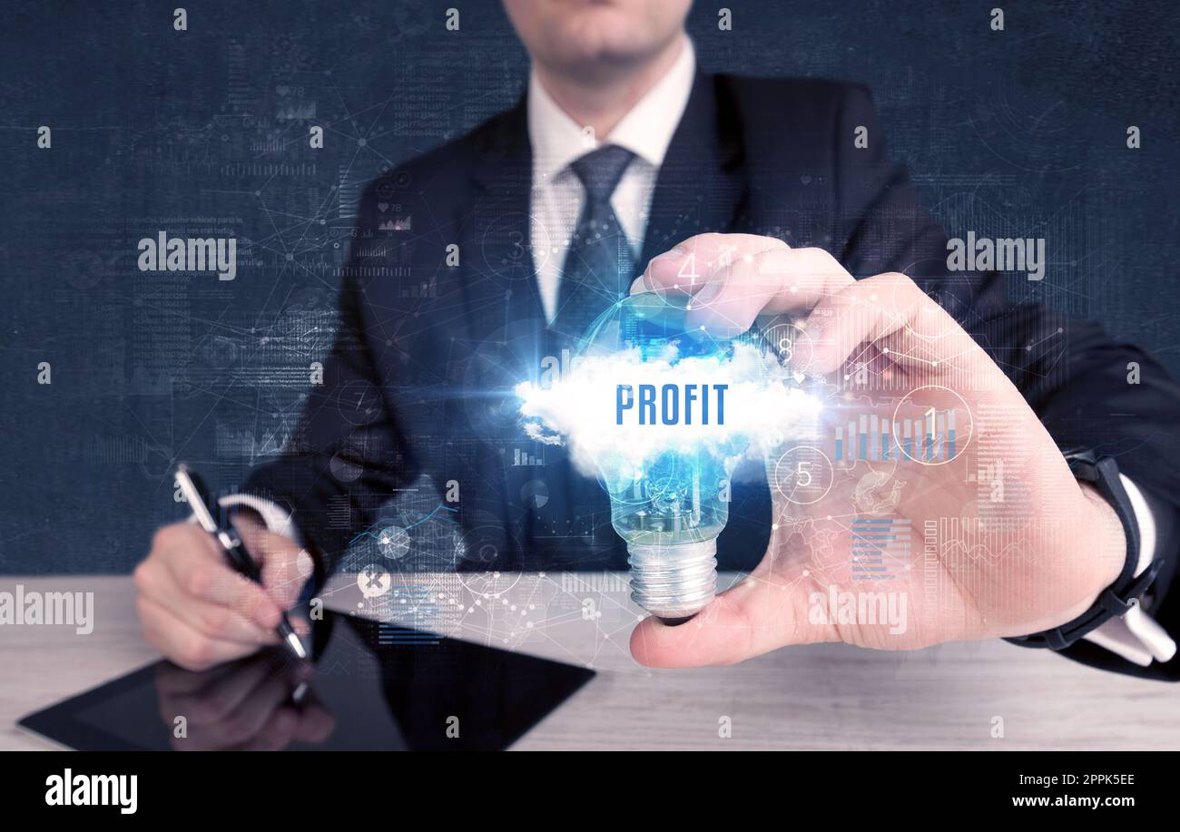 Businessman holding a light bulb, business concept Stock Photo - Alamy