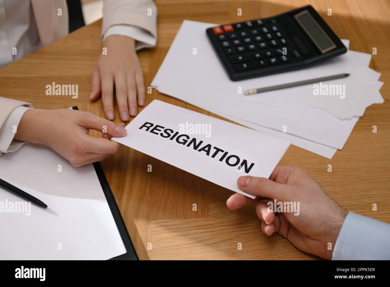 Employee giving resignation letter to boss in office, closeup Stock ...