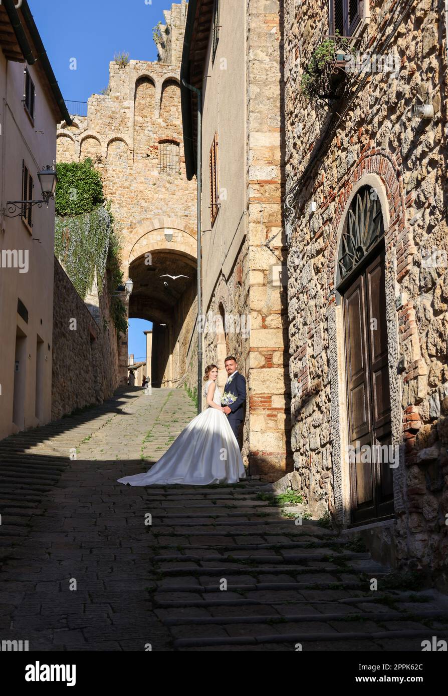 Steep and narrow street in old town of Massa Marittima, Italy Stock ...