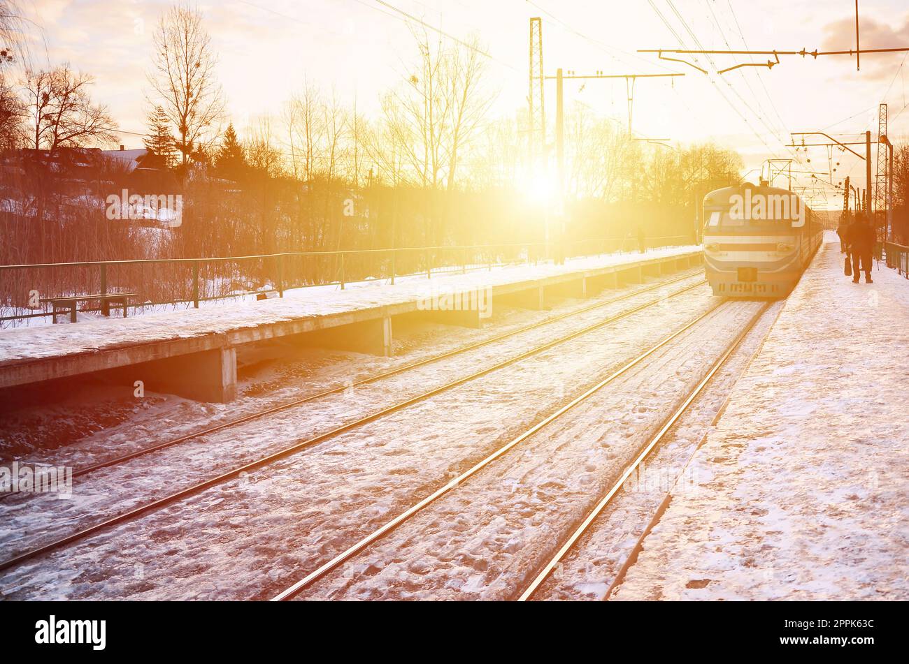 Evening winter landscape with the railway station Stock Photo - Alamy