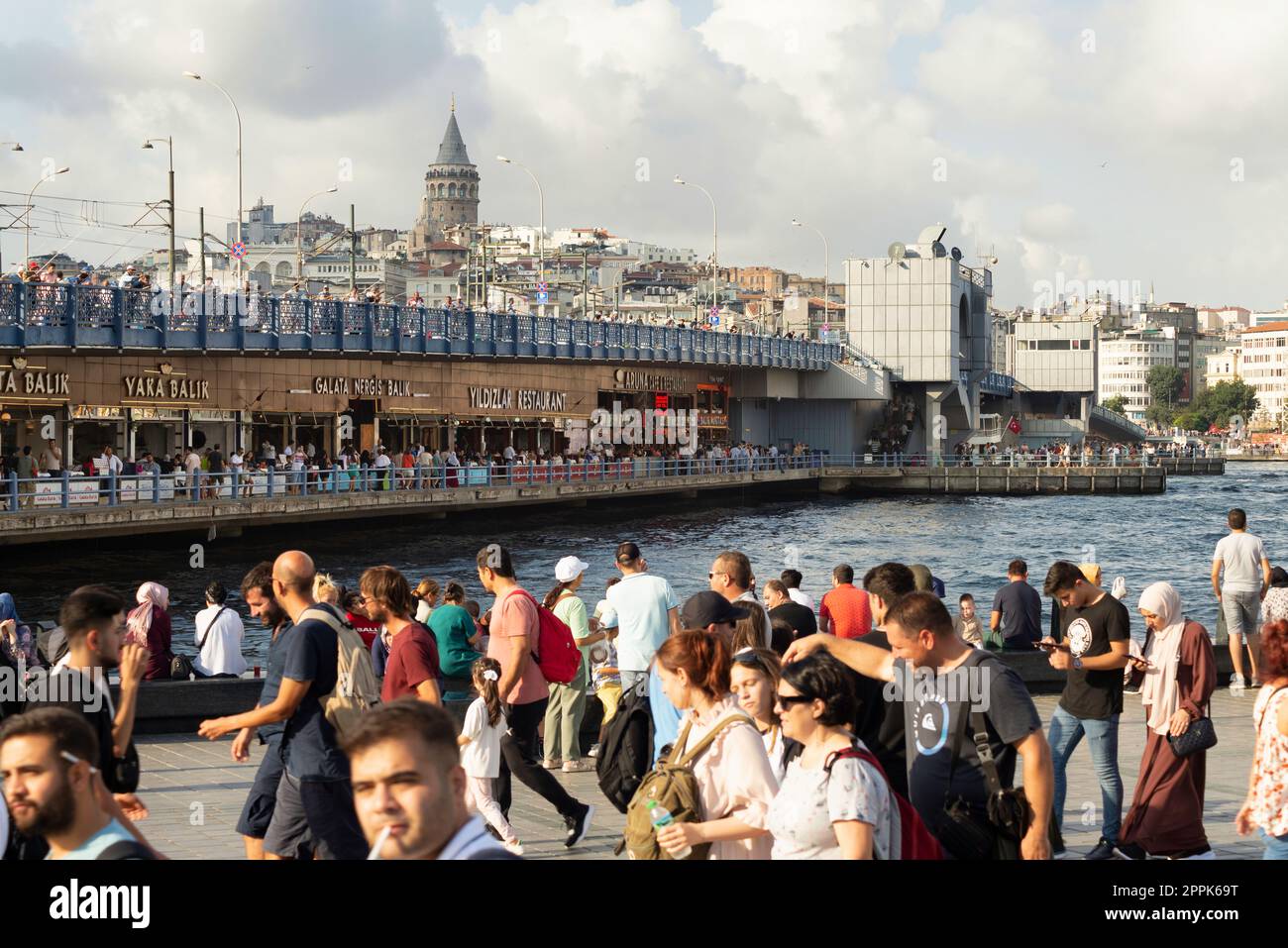 Eminonu Square overlooking Galata Bridge, Galata Tower, and crowds of ...