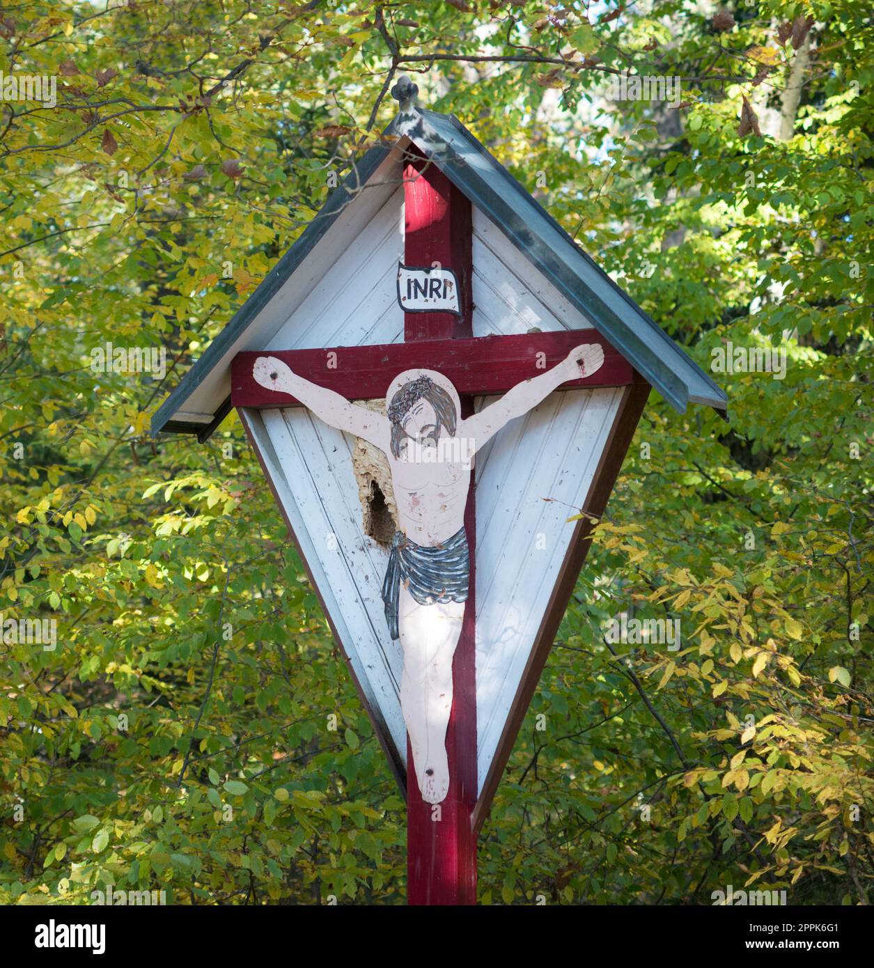 naive art jesus statue with nest of hornets Stock Photo - Alamy