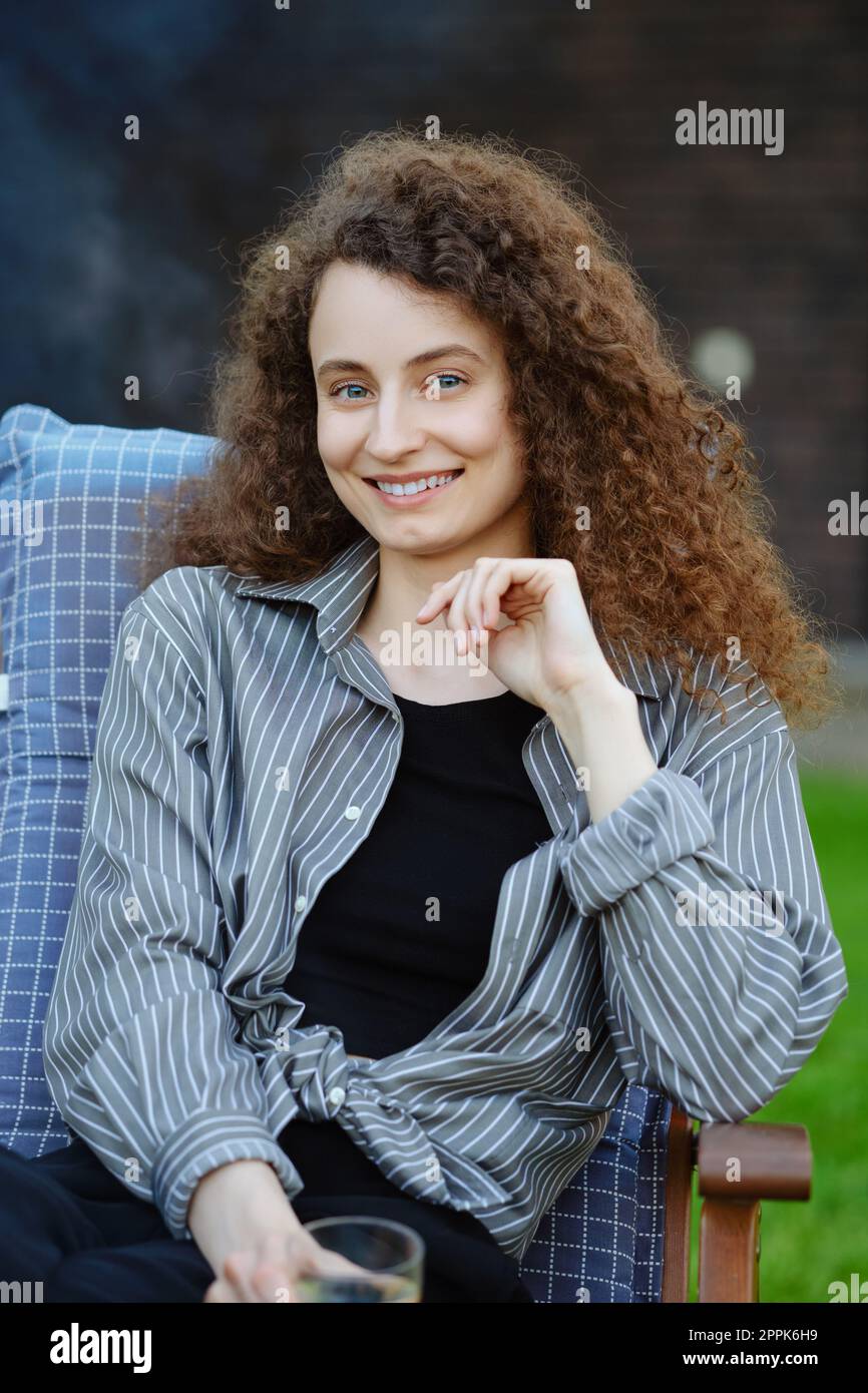Beautiful brunette curly hair woman hi-res stock photography and images - Alamy