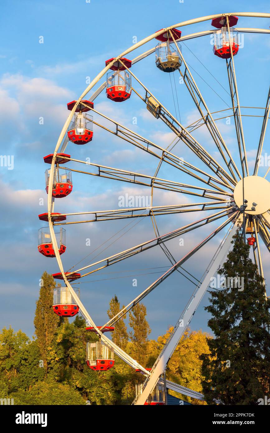 Red gondolas of the ferris wheel Stock Photo - Alamy