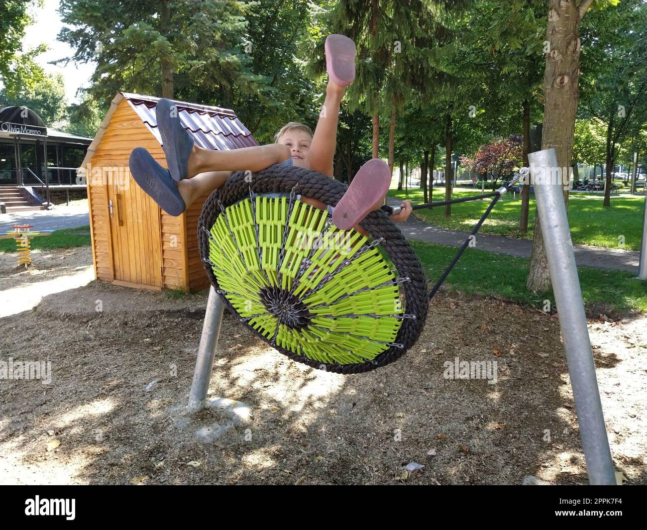Sremska Mitrovica, Serbia, 13 September 2020. Children swing on a ...