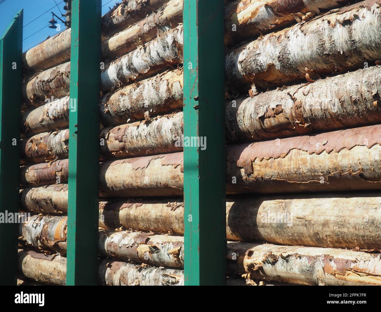 cargo timber train. Open train carriage with a bundle of timber for ...