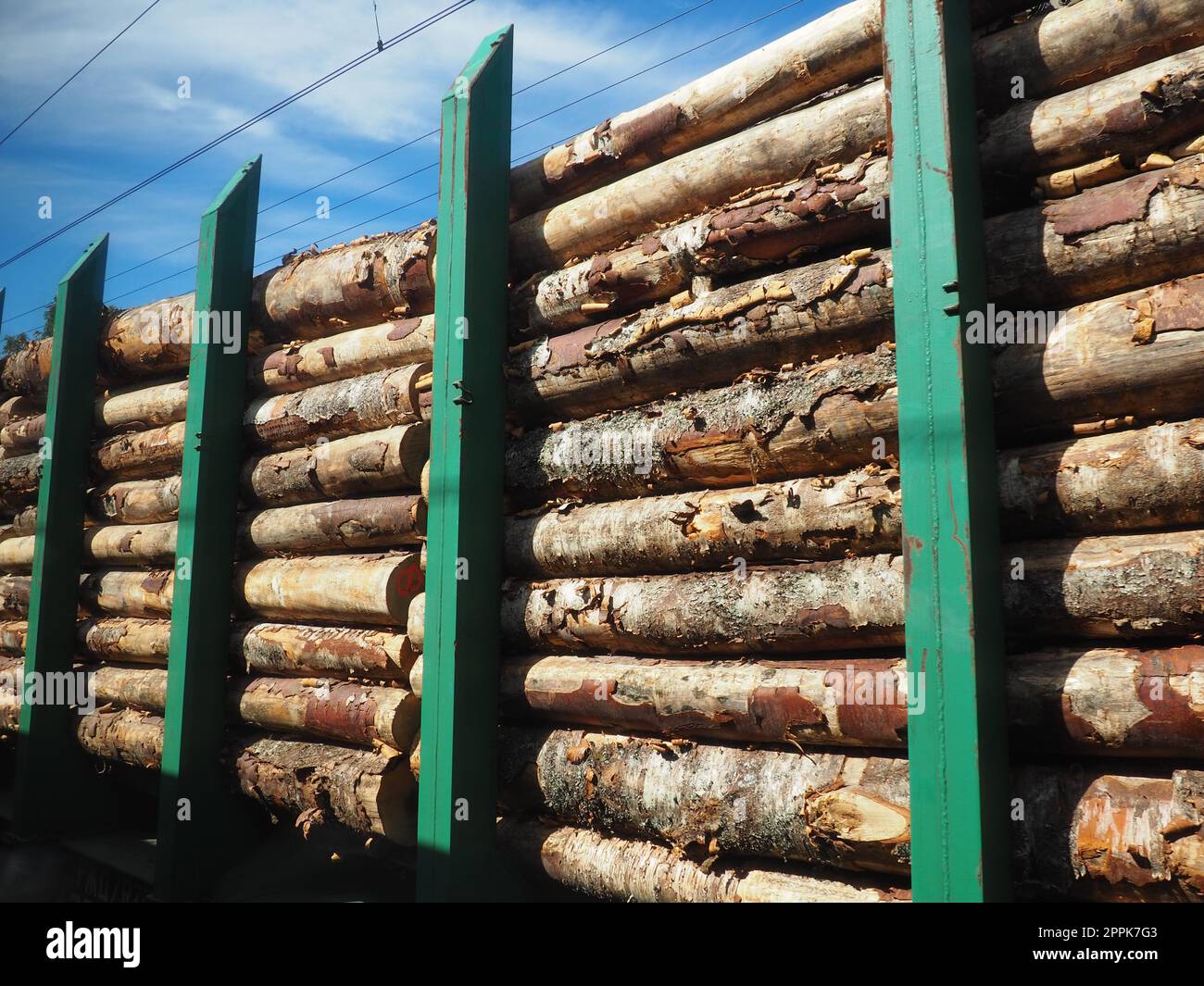 cargo timber train. Open train carriage with a bundle of timber for ...