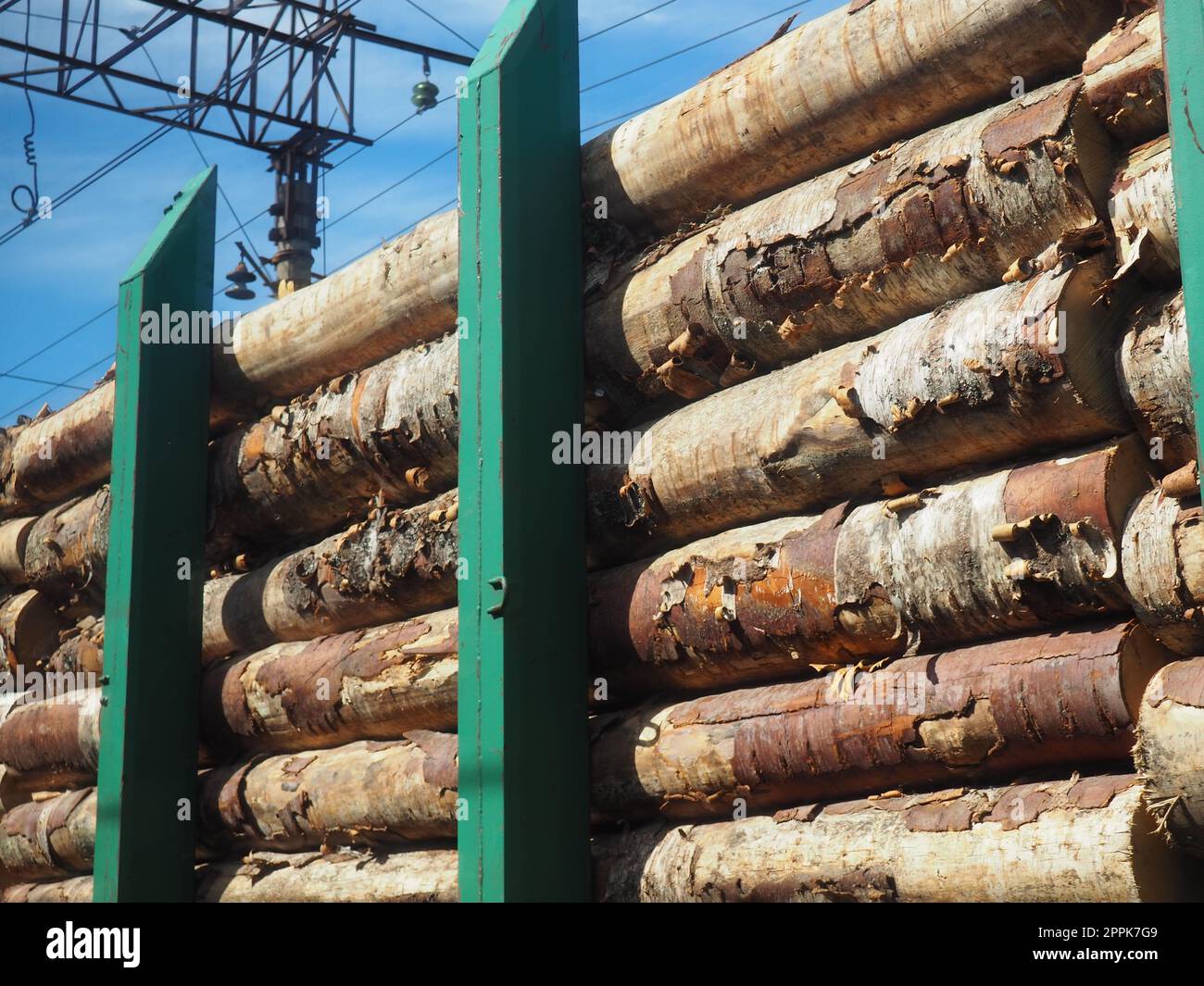 cargo timber train. Open train carriage with a bundle of timber for ...