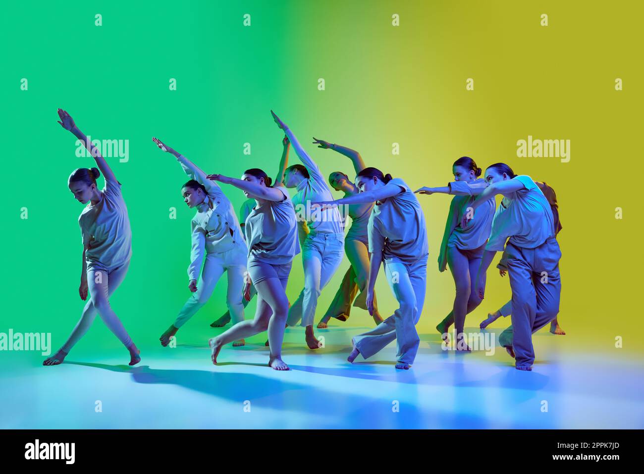 Group of young beautiful girls, dancers moving to the beat of the music ...