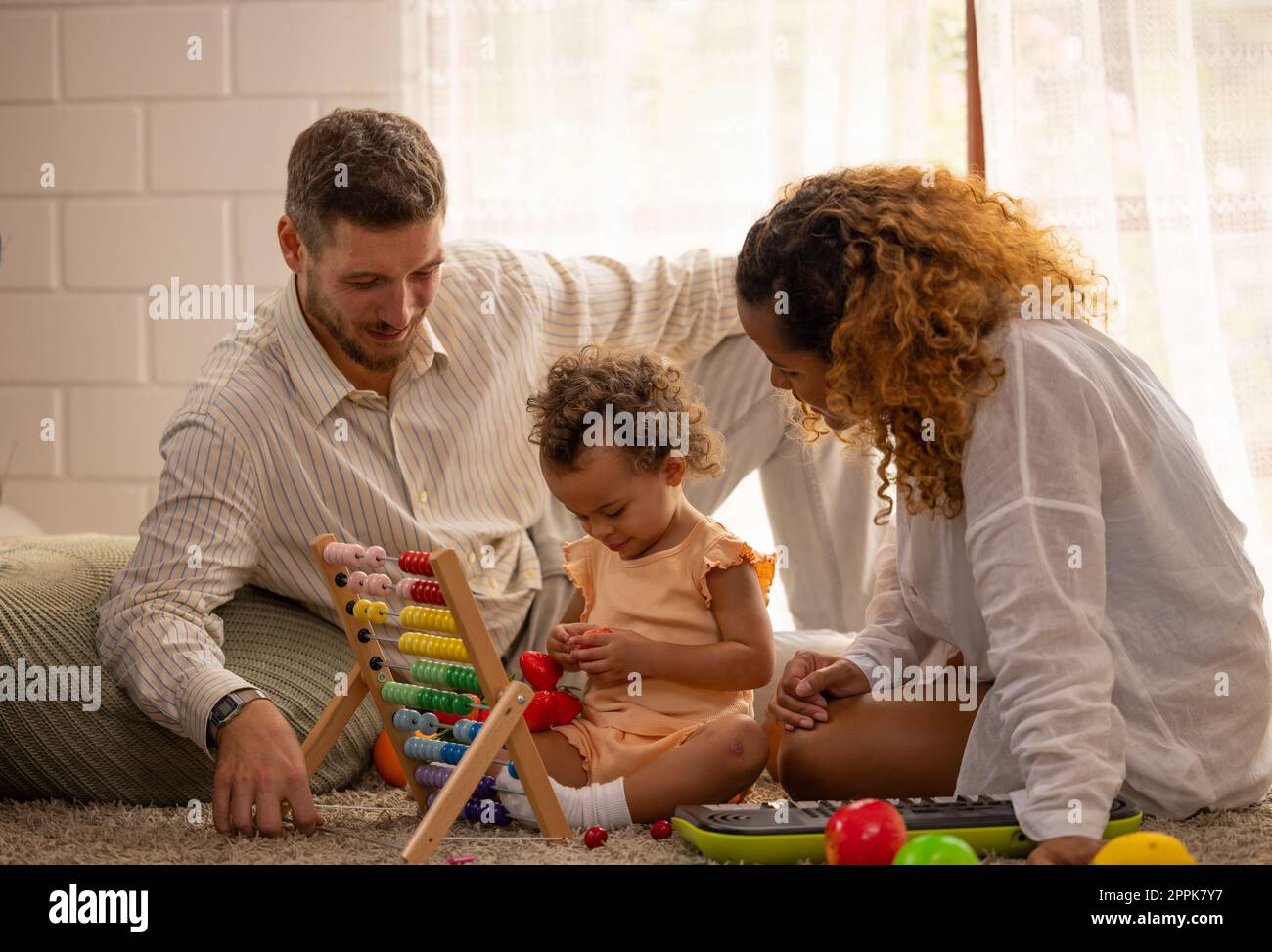 Parents teach children how to walk, hold objects, take turns, play ...