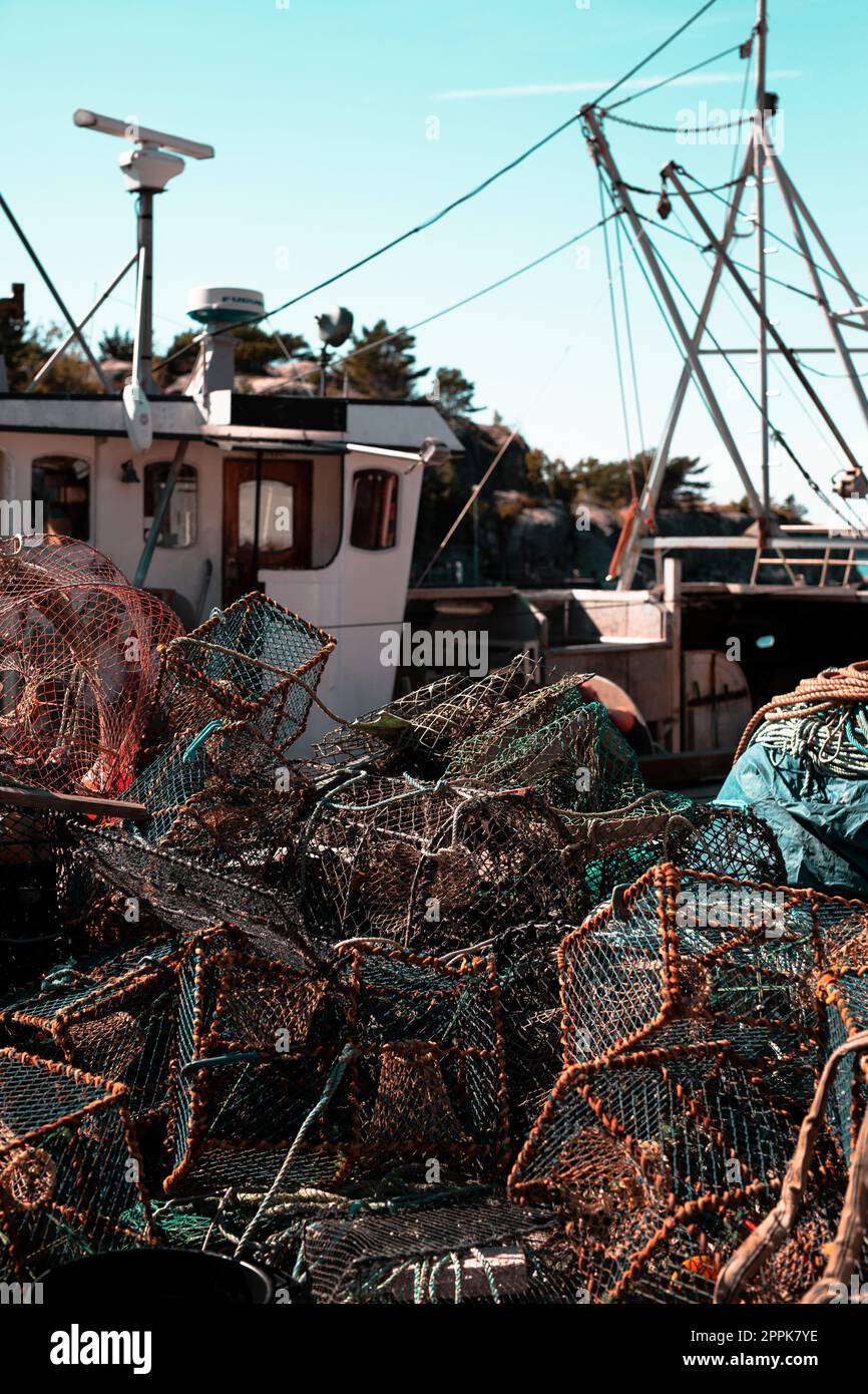 Fishing nets stacked on the pier in a harbour, close-up background ...