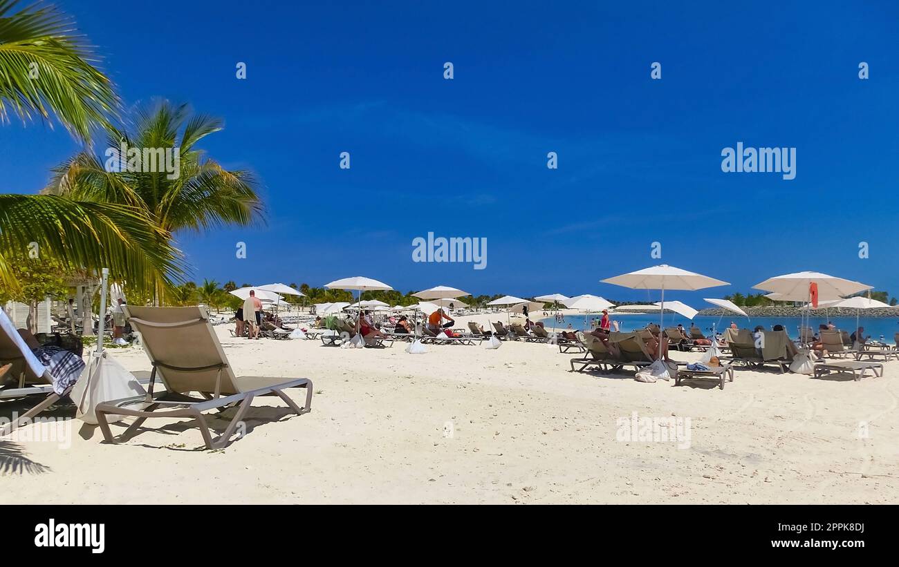 Beach on Ocean Cay Bahamas Island with a colorful houses and turquoise ...