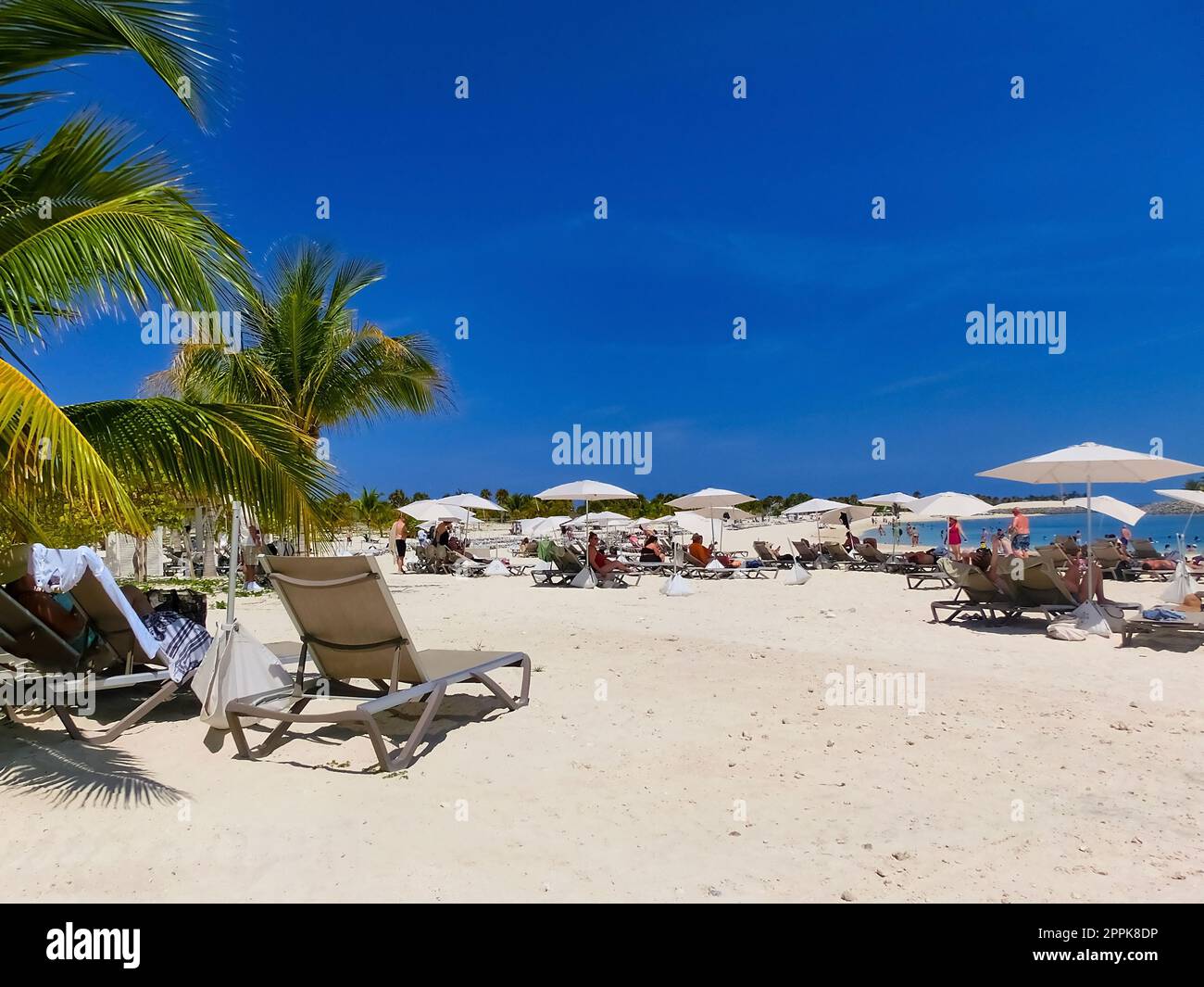 Beach on Ocean Cay Bahamas Island with a colorful houses and turquoise ...