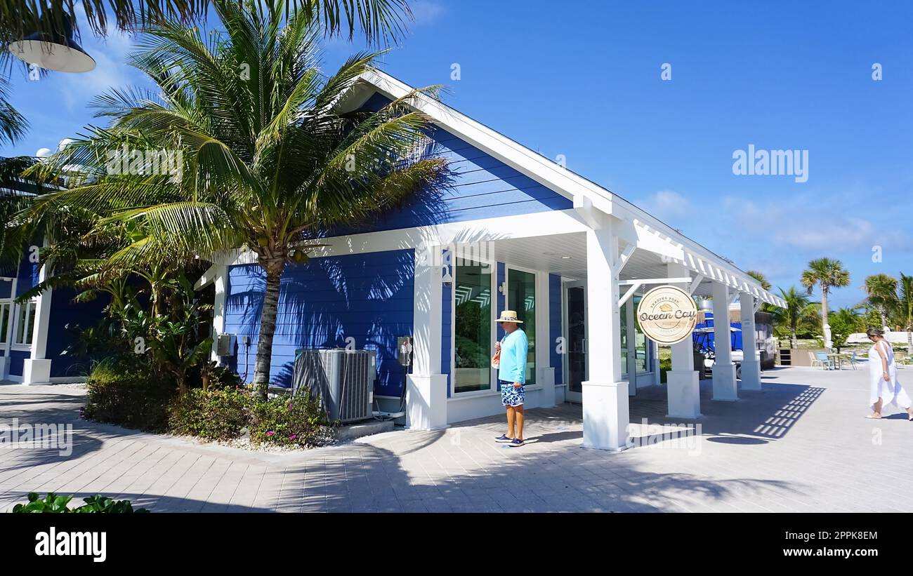 Beach on Ocean Cay Bahamas Island with a colorful houses and turquoise ...