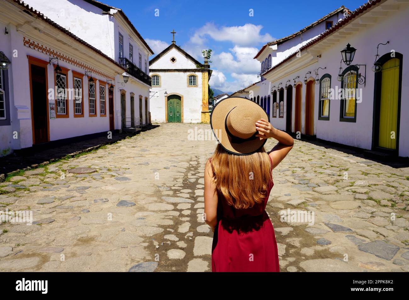 Visiting colonial architecture in Latin America. Back view of young ...