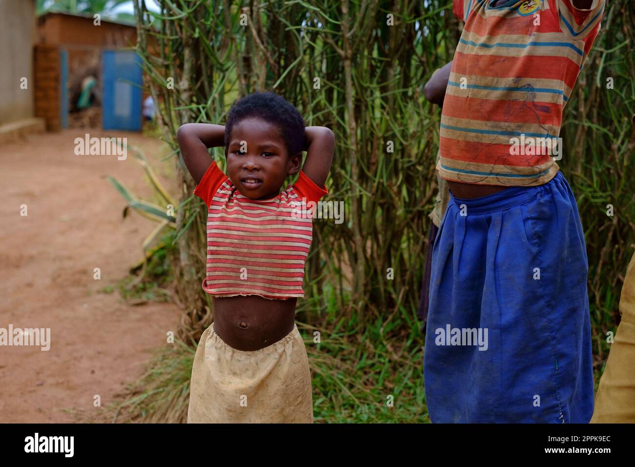 Curious child looking at camera Stock Photo - Alamy