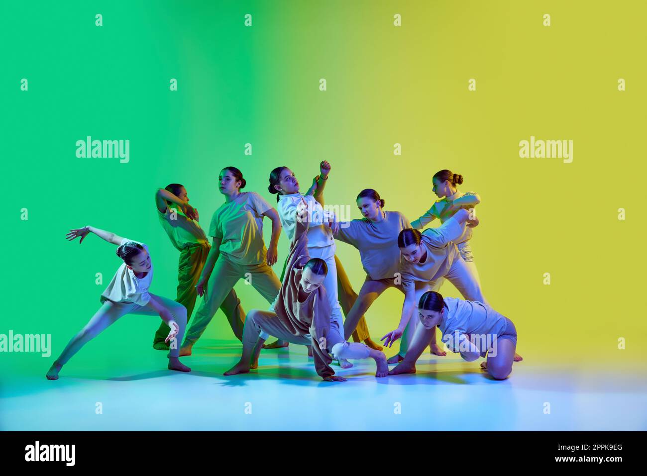 Group of young people, girls dancing contemp with different pose ...