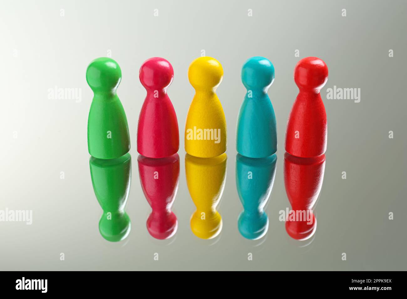 Colorful pawns on white background. Social inclusion concept Stock ...