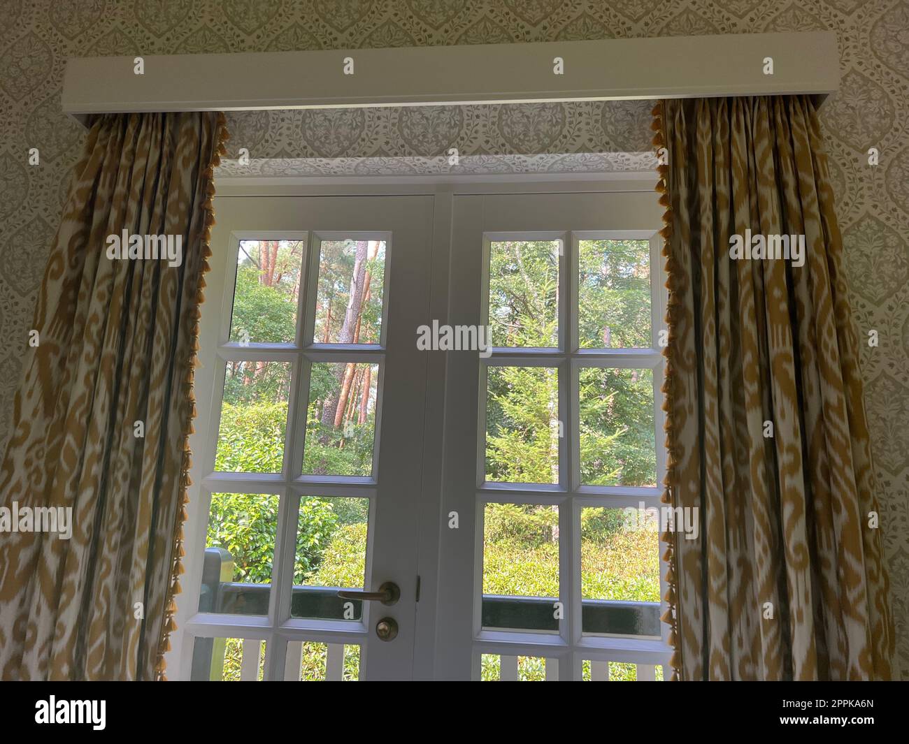Old fashioned window with beautiful curtains in room. Interior design ...
