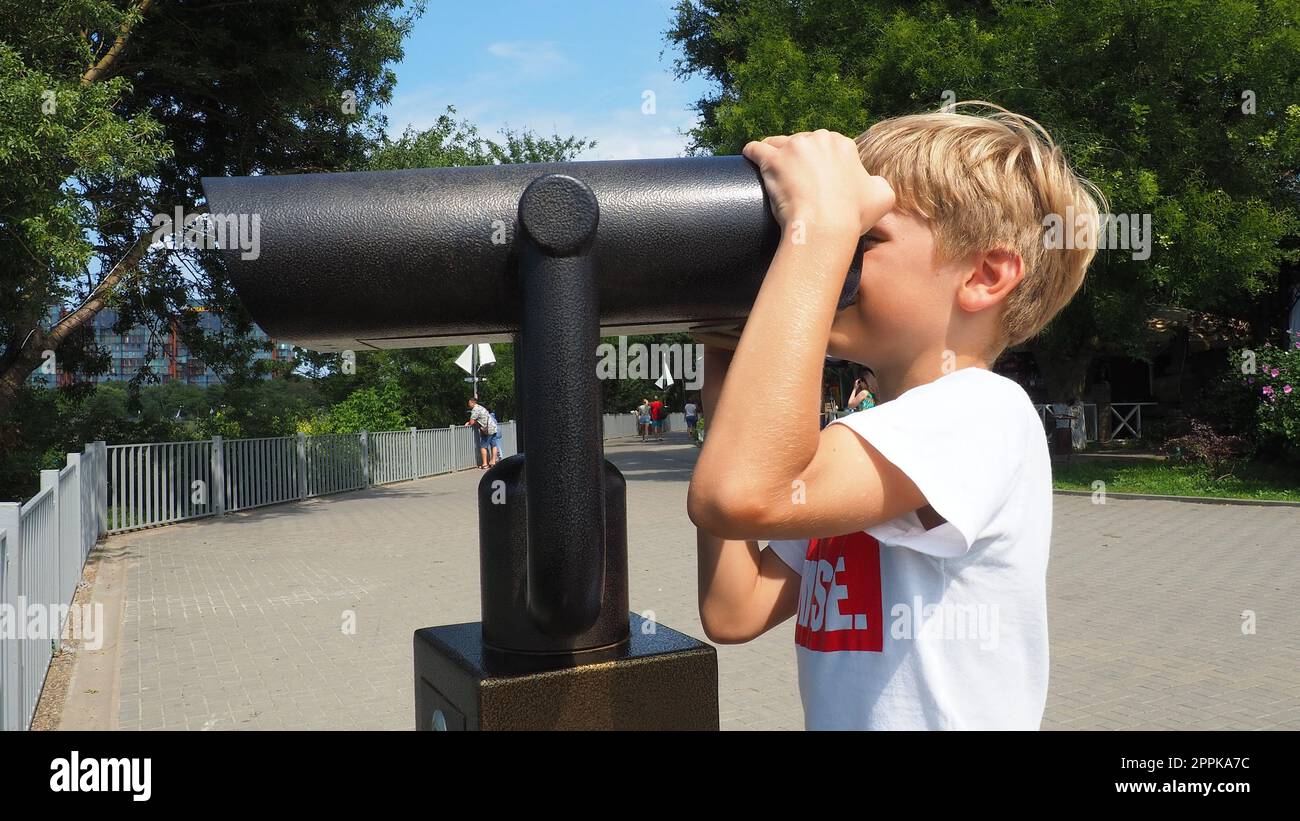 Anapa, Russia, August 23, 2021 A boy looks through an outdoor telescope ...