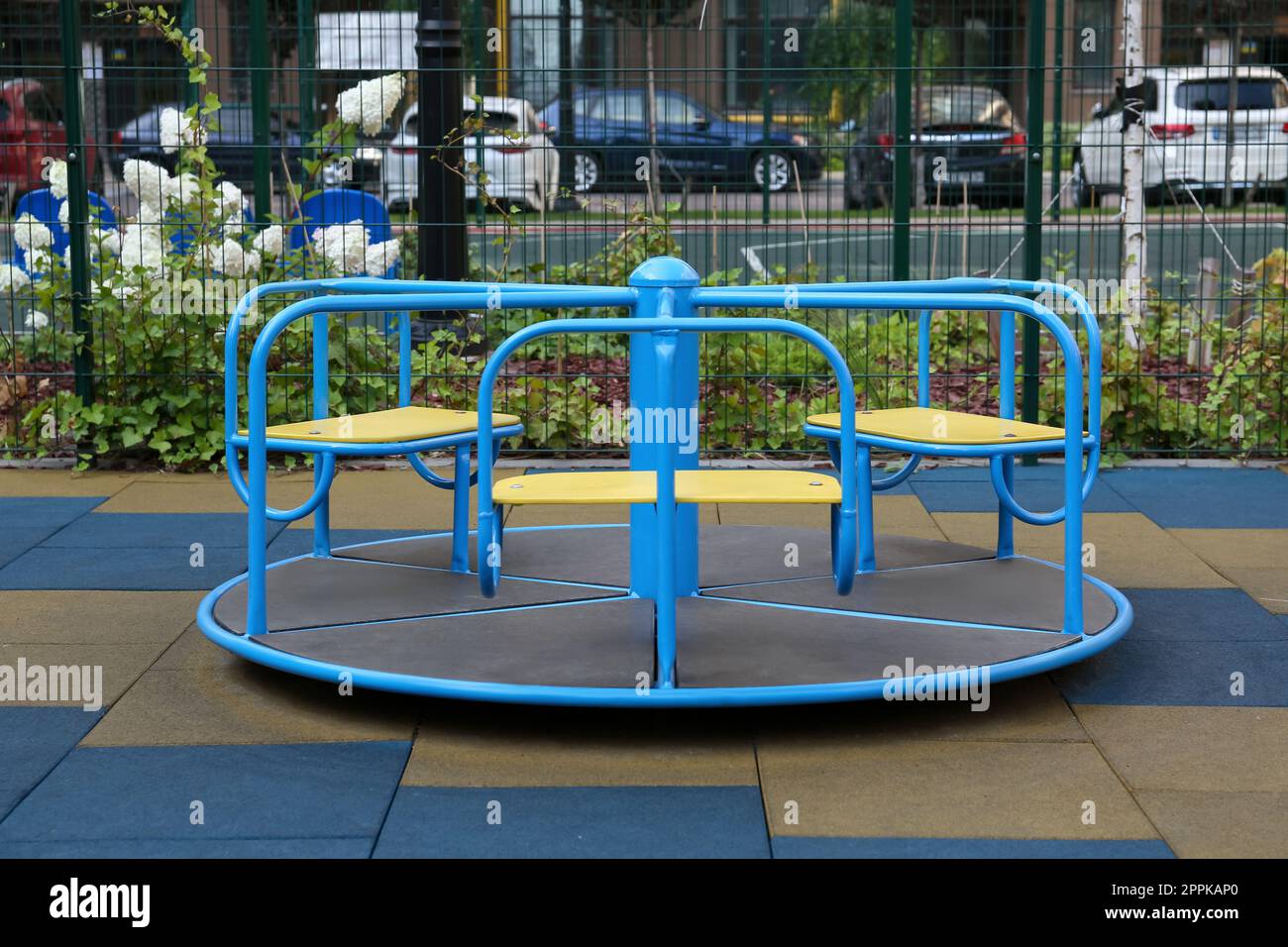 Colourful carousel for children on outdoor playground Stock Photo - Alamy