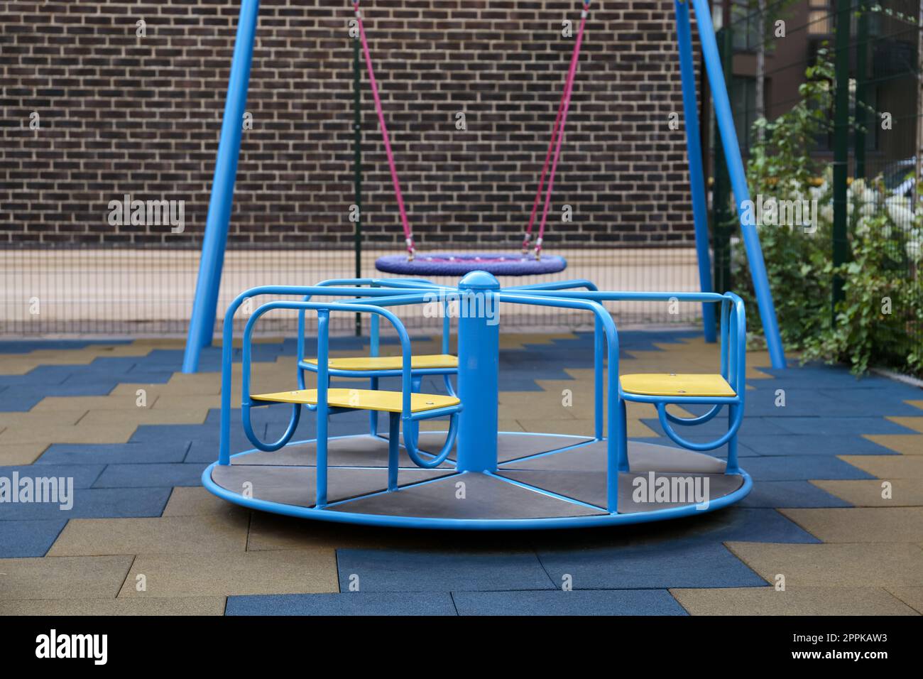 Colourful carousel for children on outdoor playground Stock Photo - Alamy