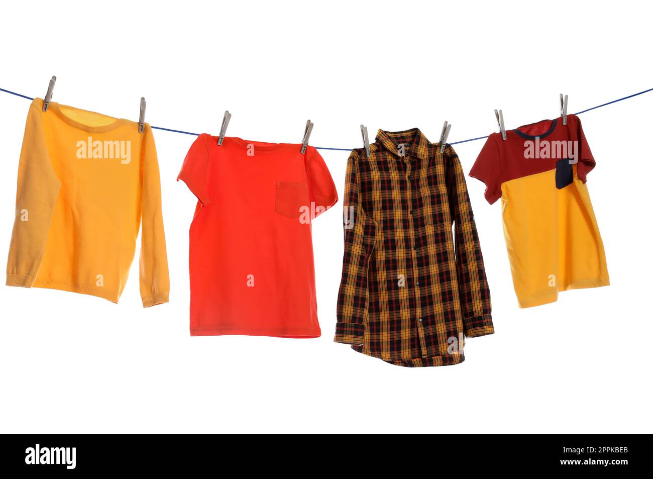 Different bright clothes drying on washing line against white ...