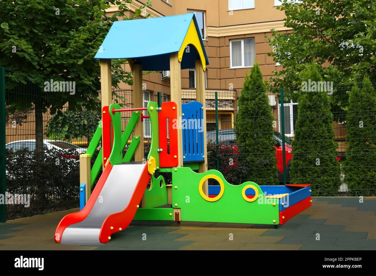 Empty outdoor children's playground with slide in residential area ...