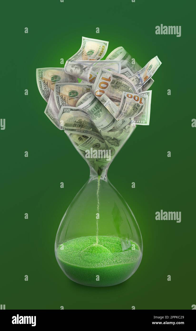 Time is money. Hourglass full of dollar banknotes converting into sand ...