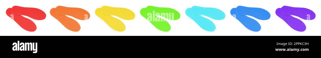 Set with colorful orthopedic insoles on white background, top view ...