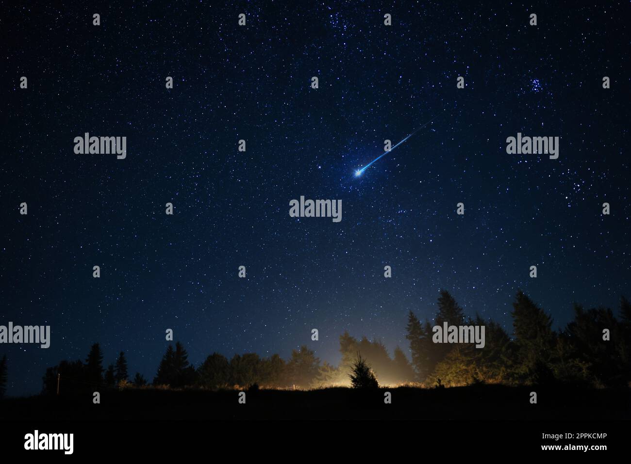 Beautiful view of shooting star in night sky Stock Photo - Alamy